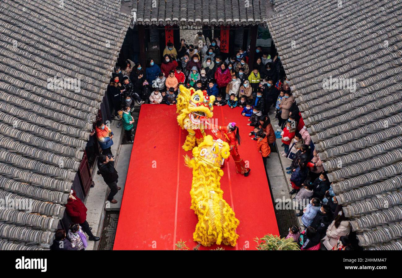 HAIAN, CHINA - JANUARY 25, 2022 - People watch a dragon dance ...