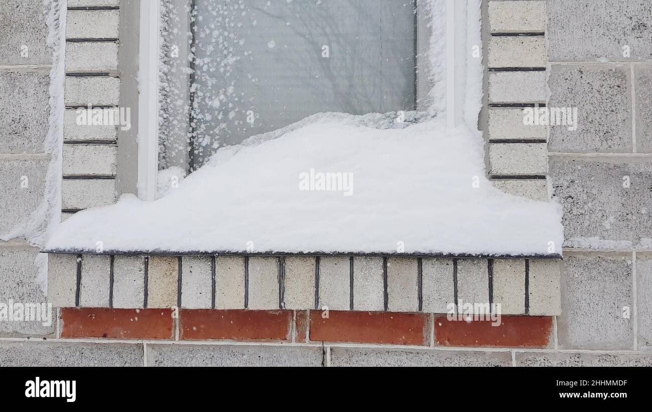 Window and windowsill covered with snow, small snowdrift on sill Stock ...