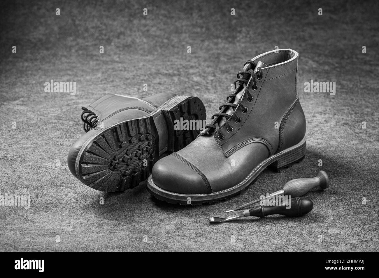 Handcrafted brown leather shoes with cobbler tools Stock Photo - Alamy
