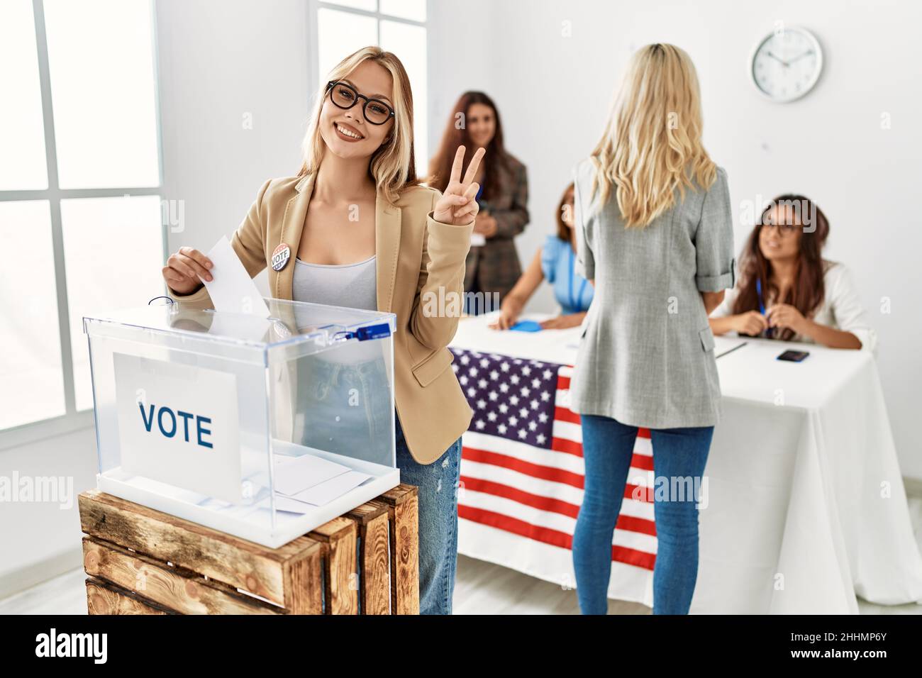 Group of young girls voting at democracy referendum smiling looking to ...
