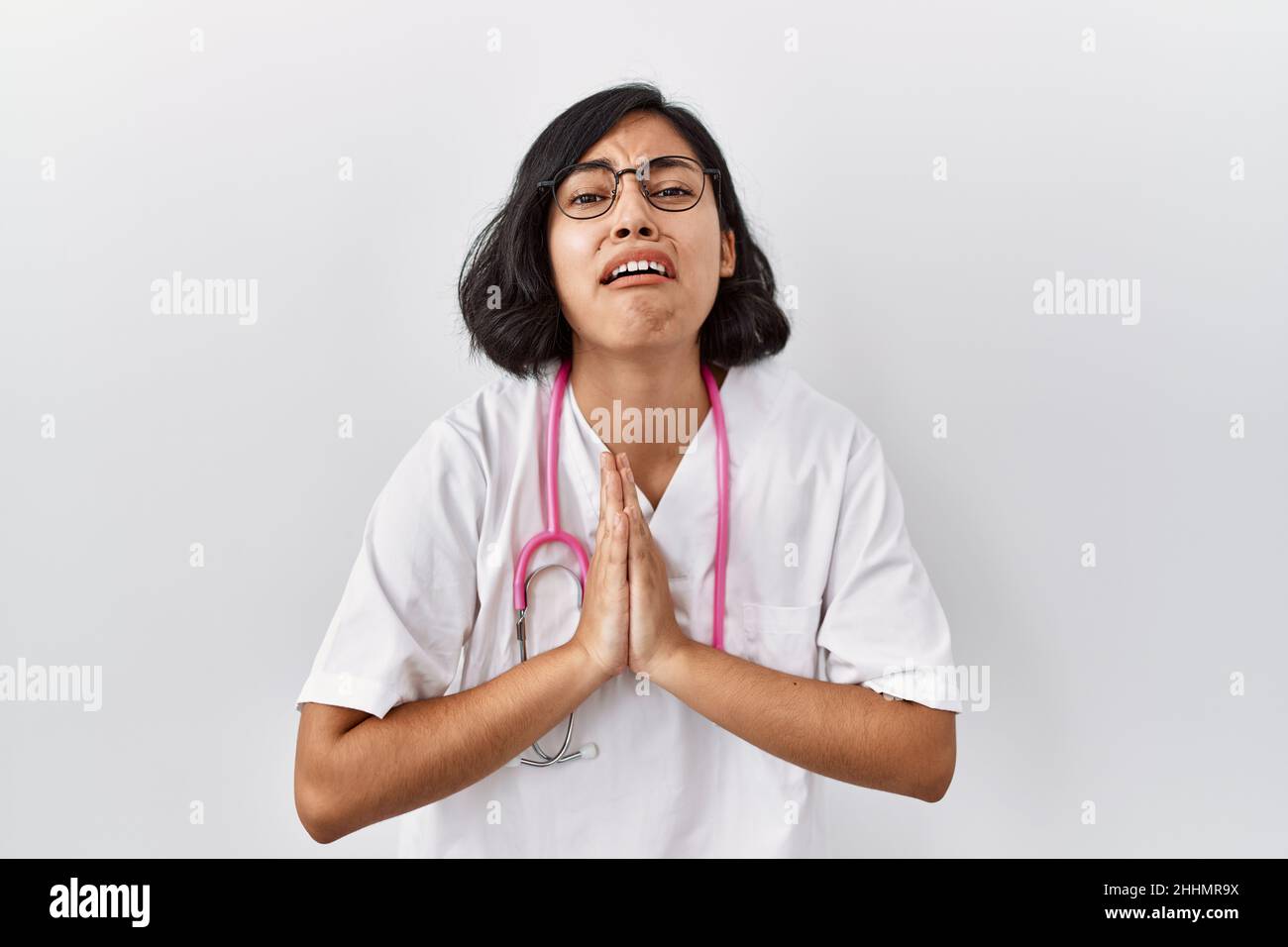 Young hispanic doctor woman wearing stethoscope over isolated ...
