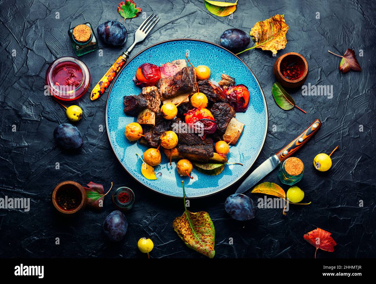 Succulent beef ribs roasted in plums and pears.Meat ribs in fruit ...