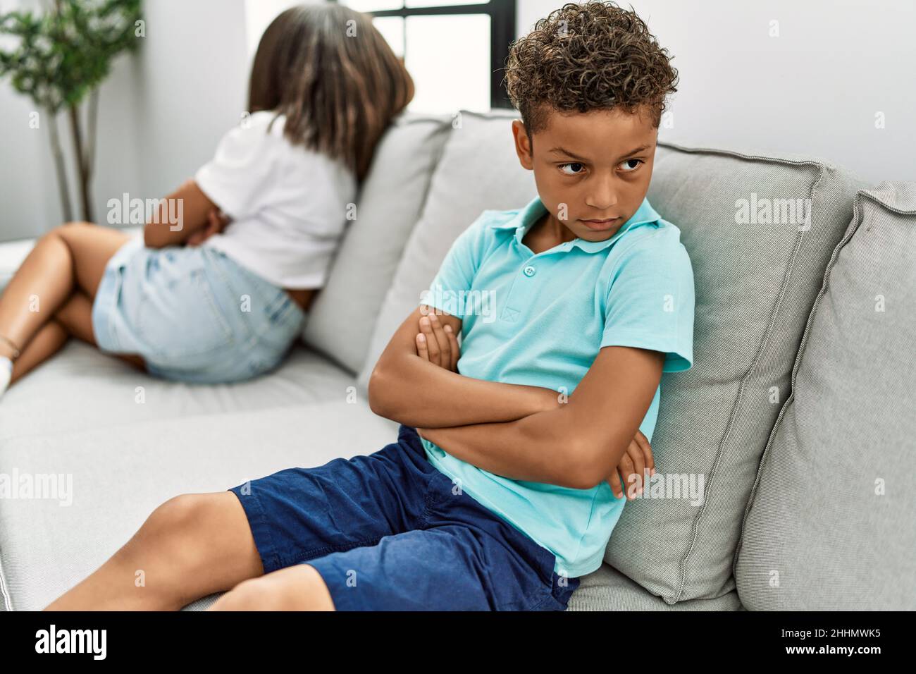 Brother and sister angry having problem sitting on sofa at home Stock ...