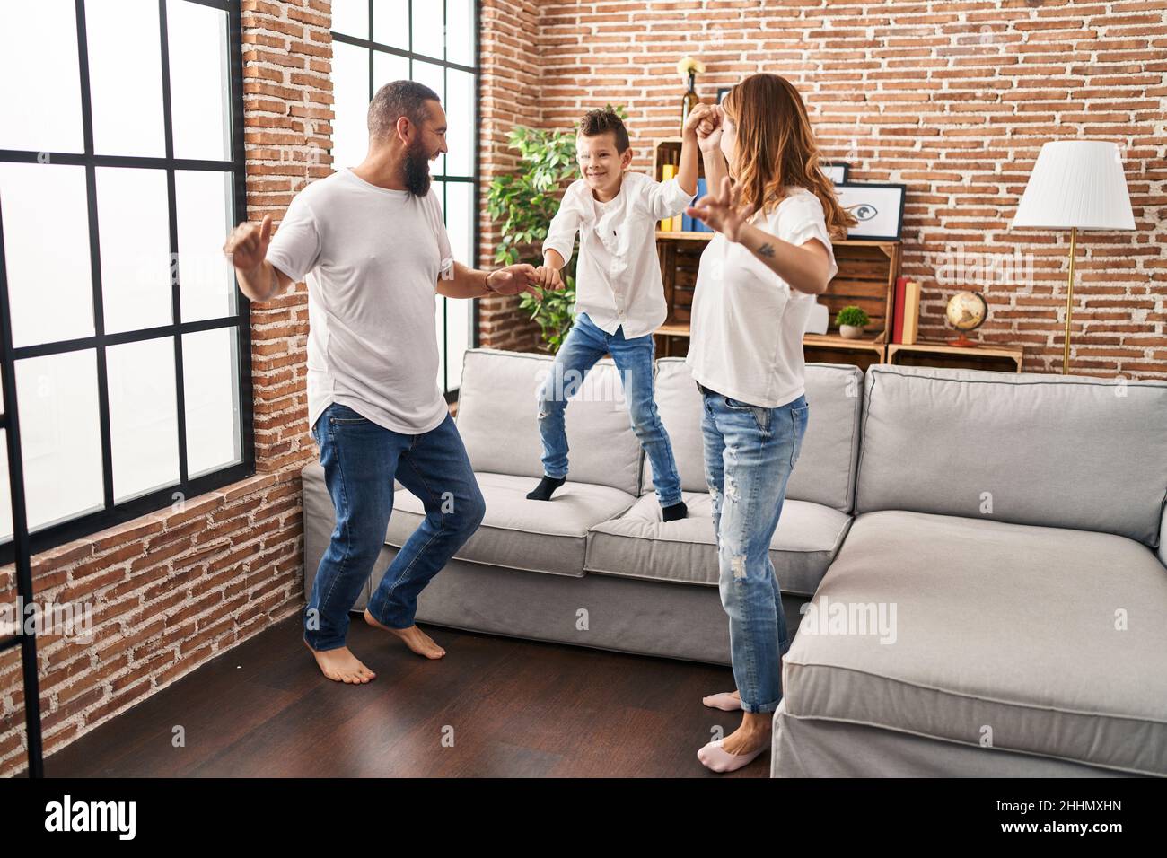 Family smiling confident dancing at home Stock Photo - Alamy