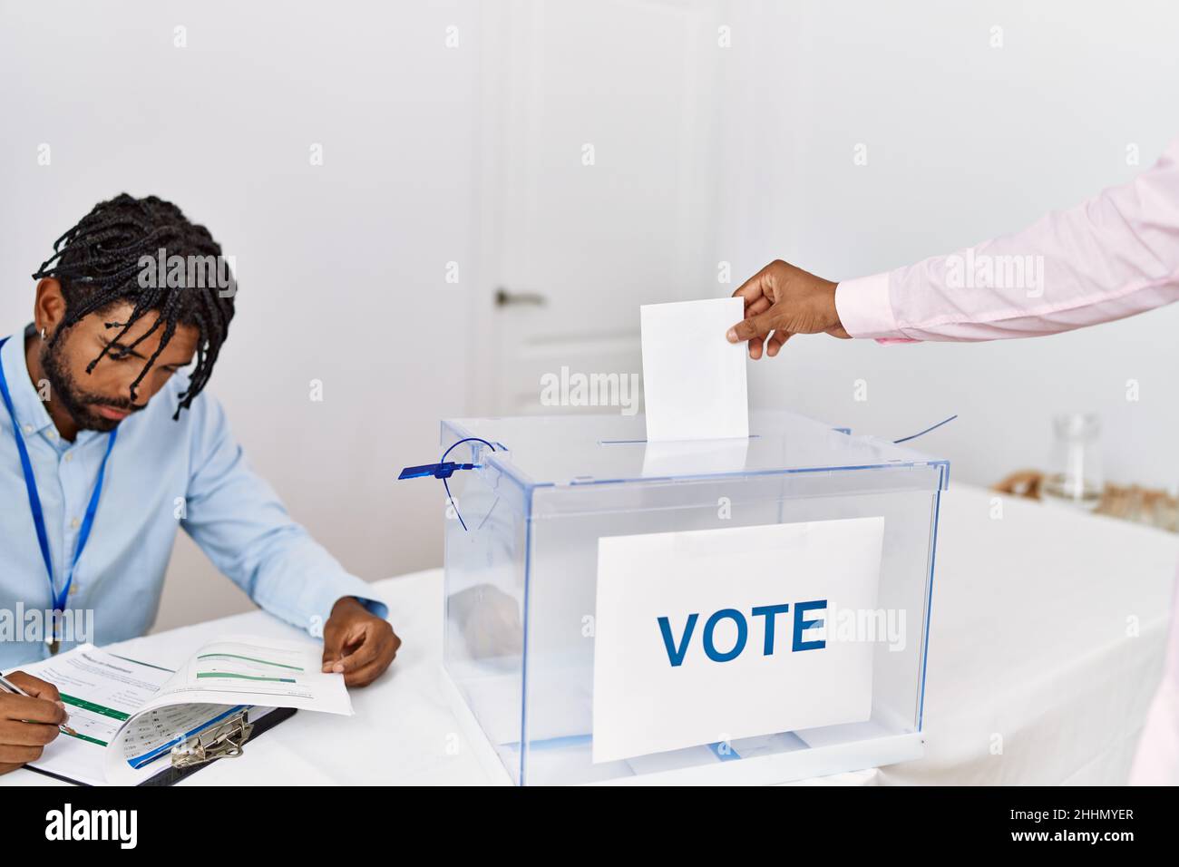 Two men voting at electoral college Stock Photo - Alamy