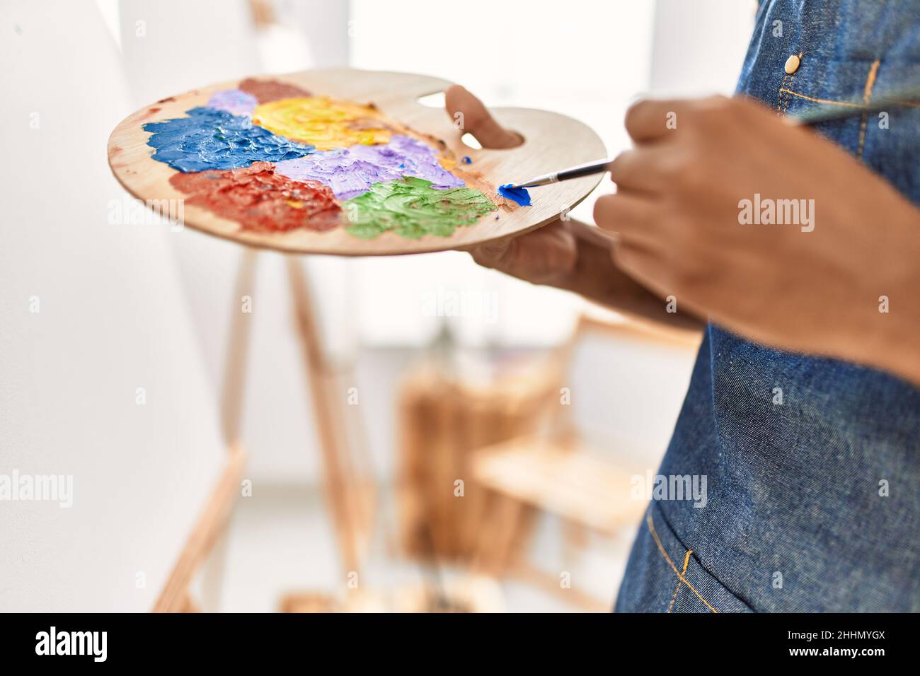 Hand of african american artist man painting at art studio Stock Photo ...