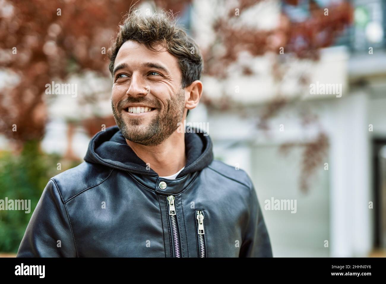 Handsome hispanic man with beard smiling happy outdoors Stock Photo - Alamy
