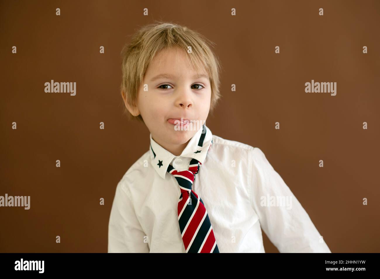 Cute toddler child, boy with smart casual clothing on isolated ...