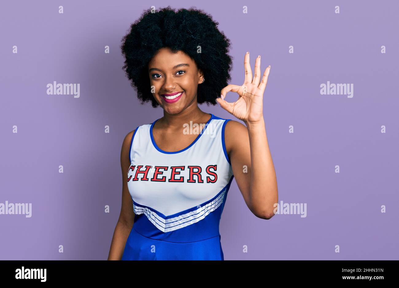 Young african american woman wearing cheerleader uniform smiling ...
