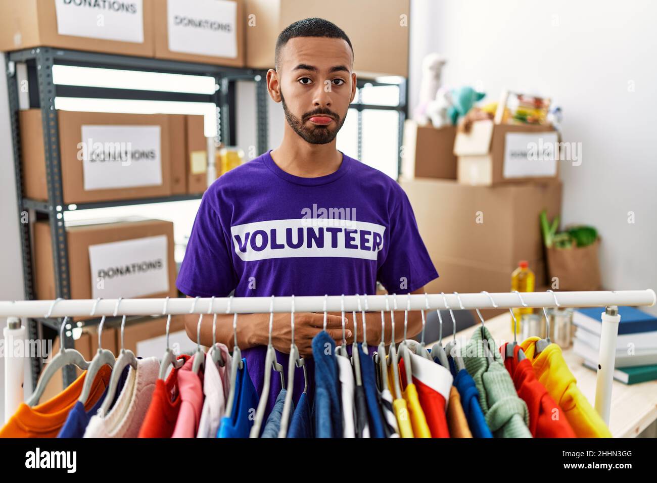 African american man wearing volunteer t shirt at donations stand ...