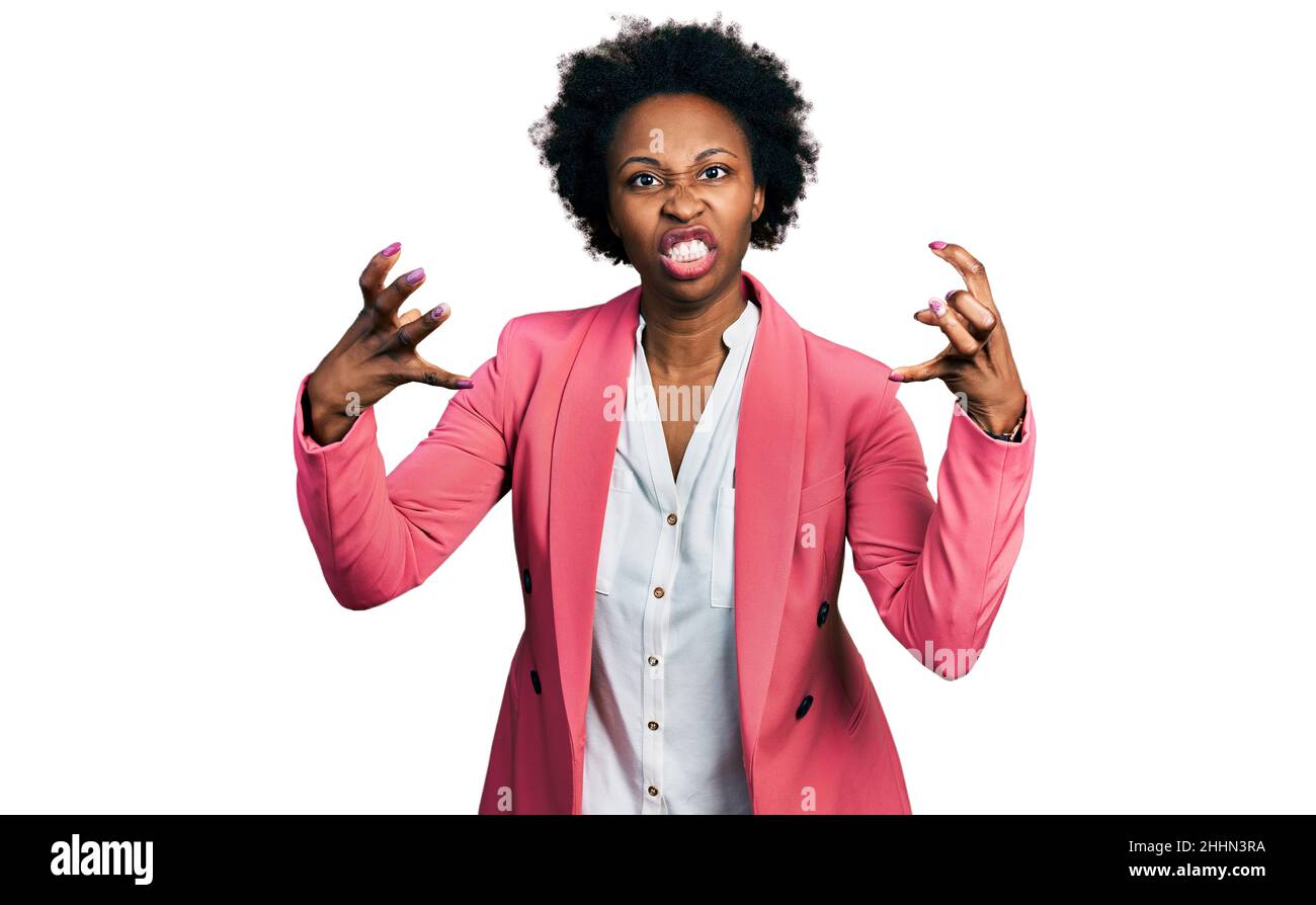 African american woman with afro hair wearing business jacket shouting ...