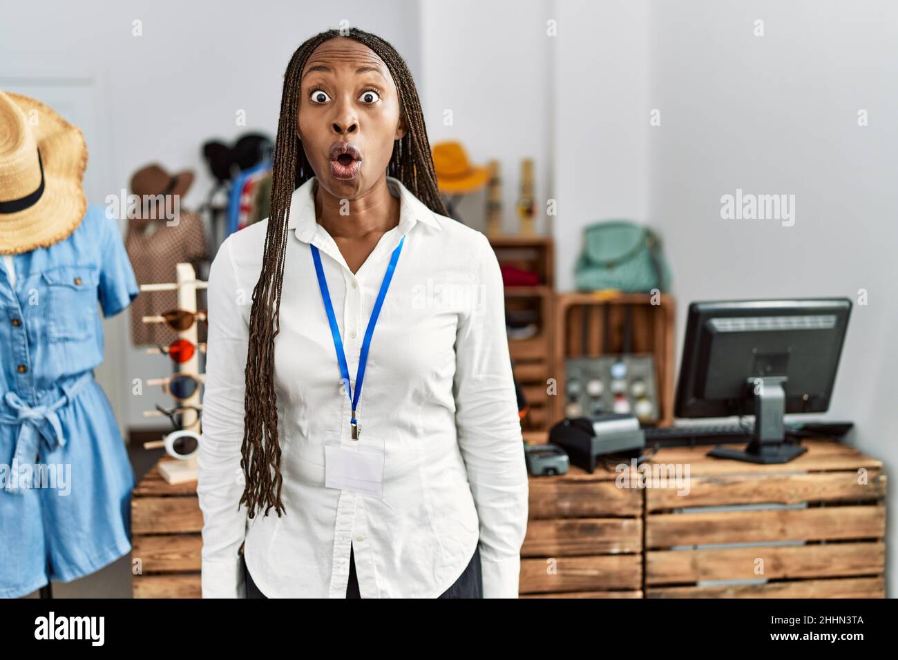 Black woman with braids working as manager at retail boutique afraid ...