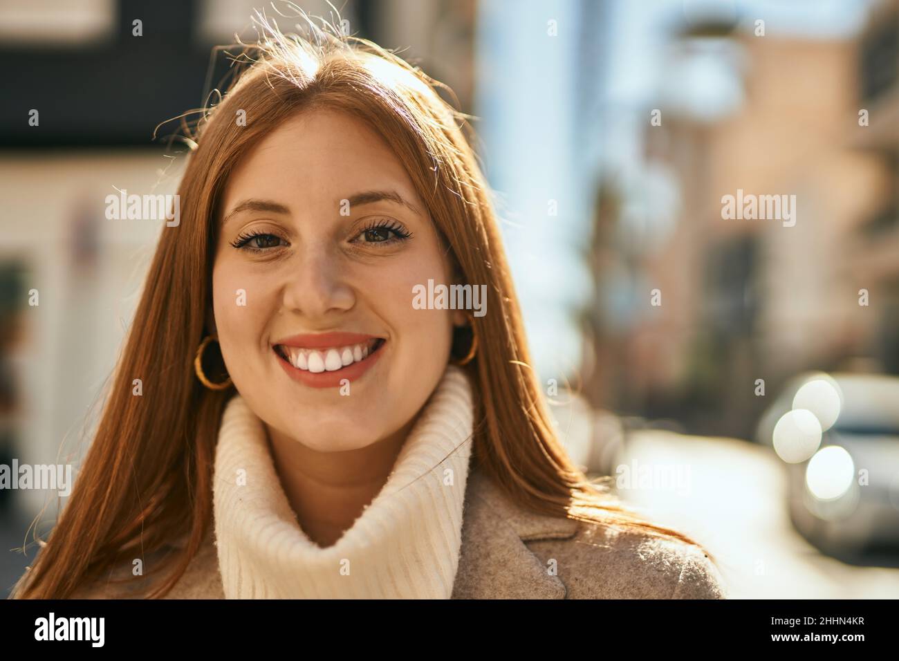 Young redhead girl smiling happy standing at the city Stock Photo - Alamy