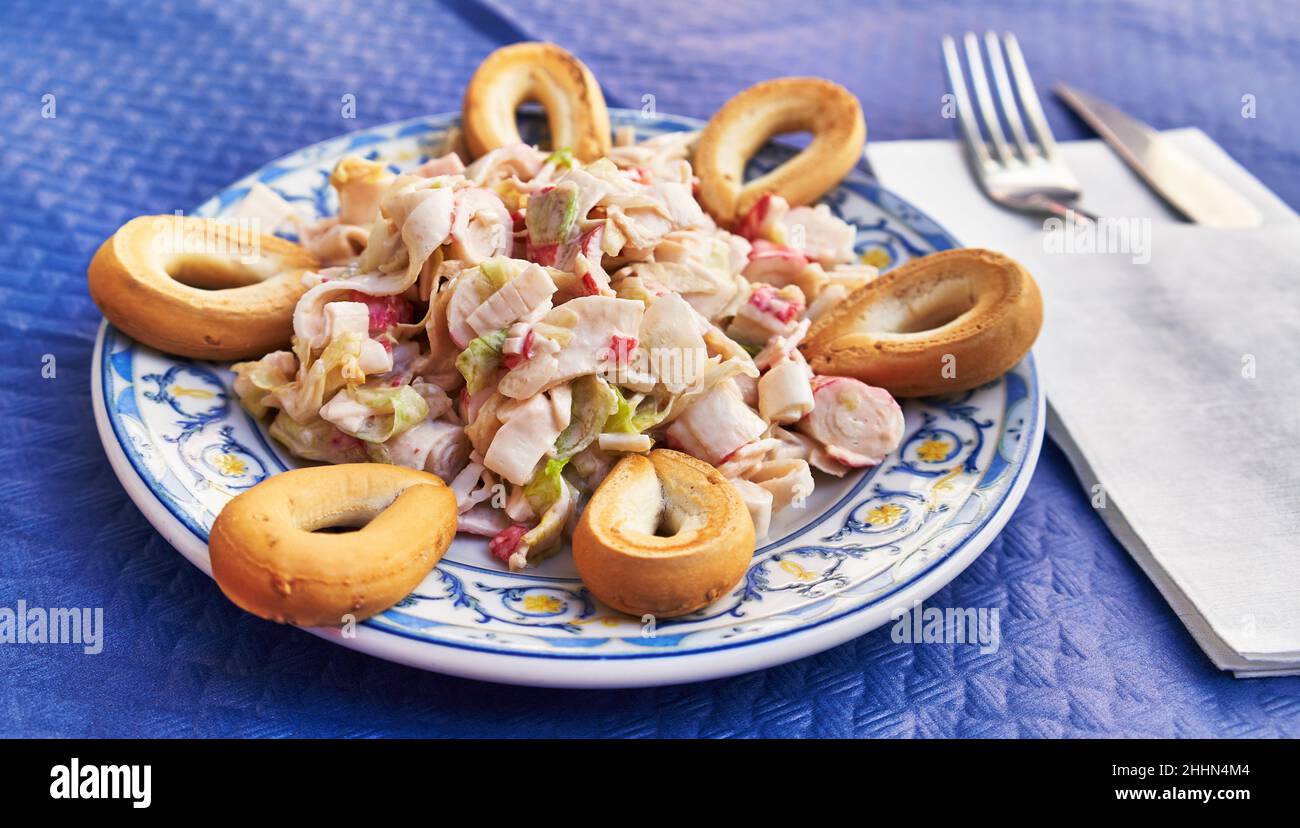 Plate of spanish salad on paper surface Stock Photo - Alamy