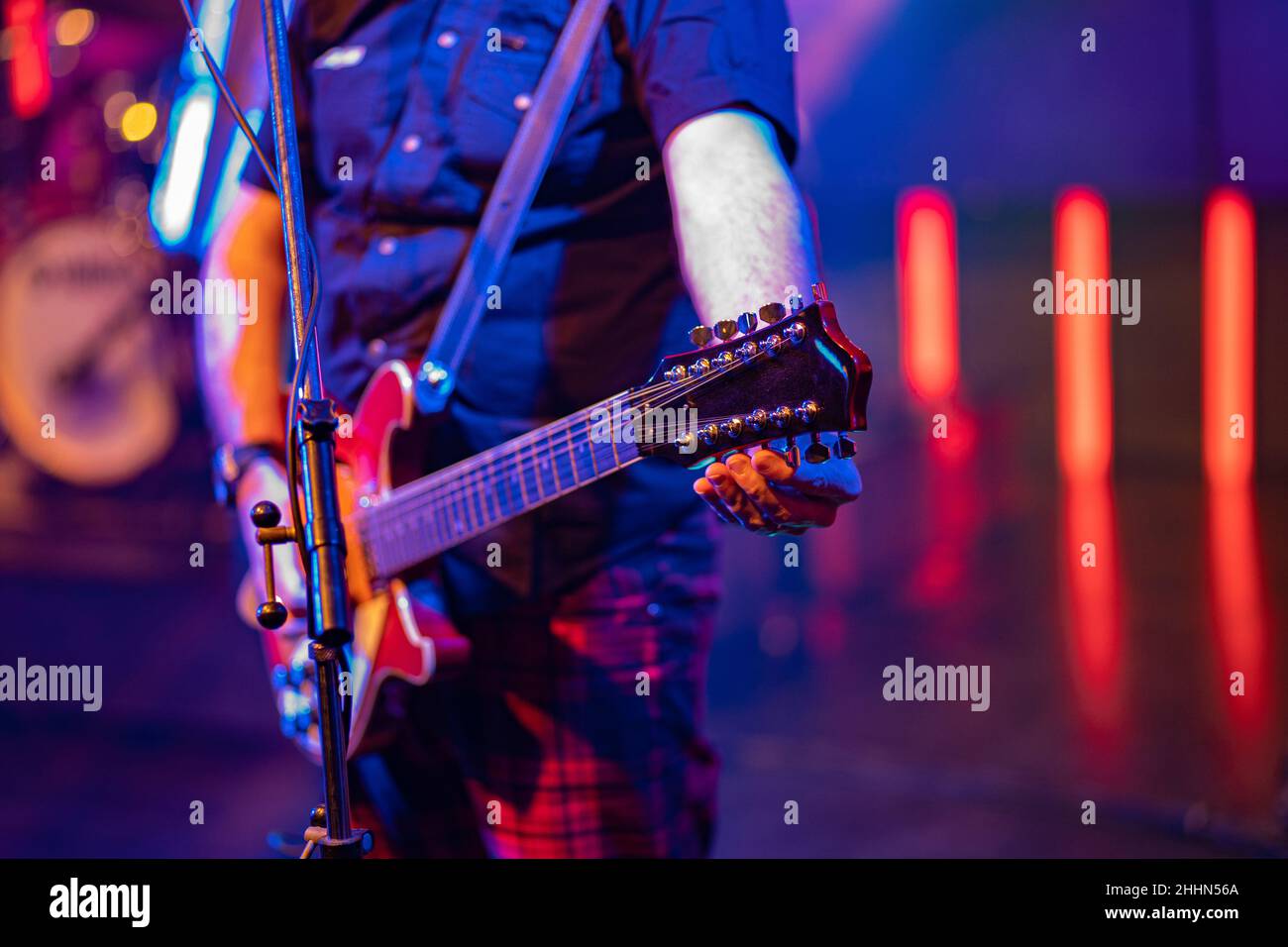 Photo of a guitarist performing on stage Stock Photo - Alamy