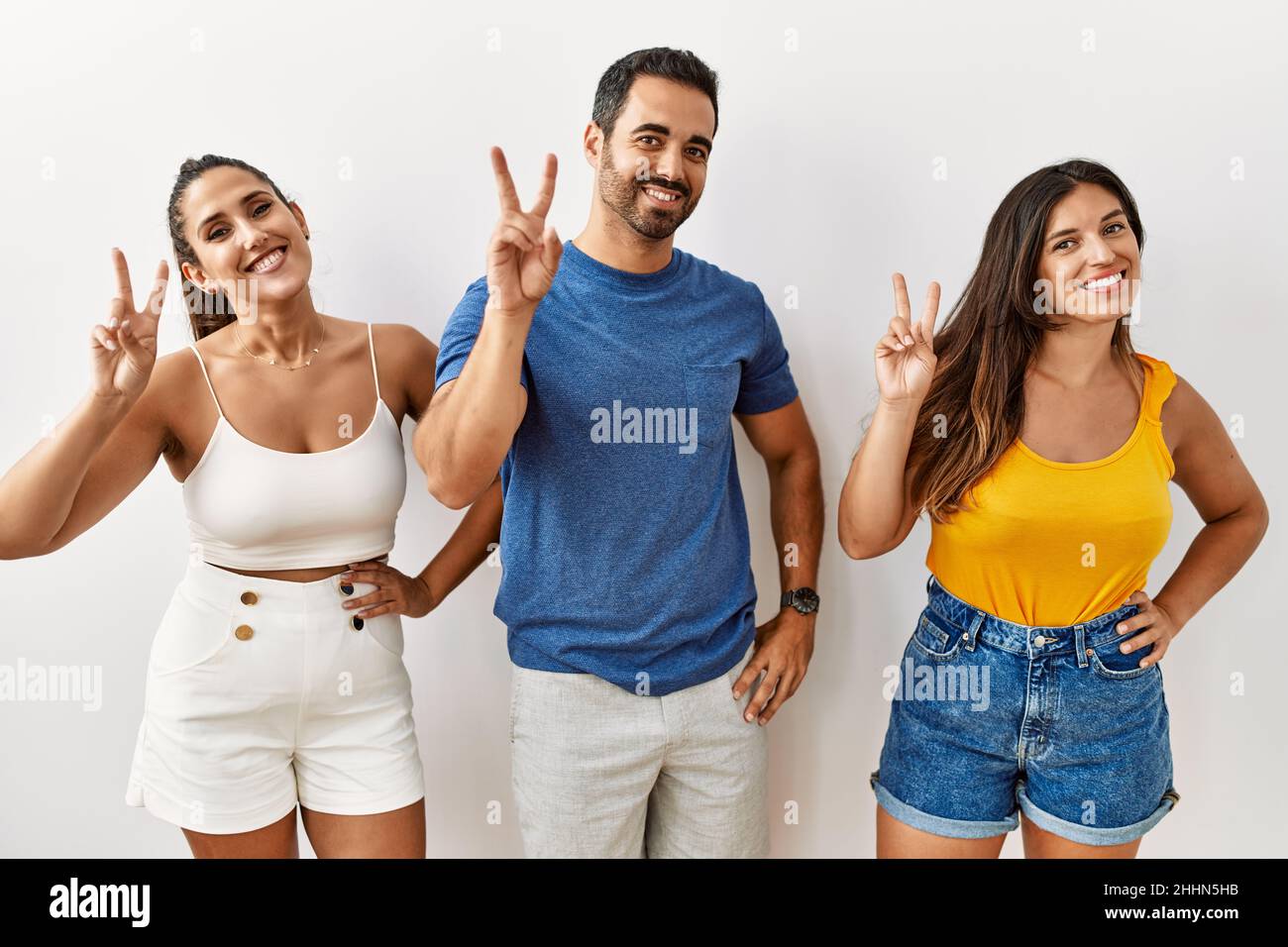 Group of young hispanic people standing over isolated background ...