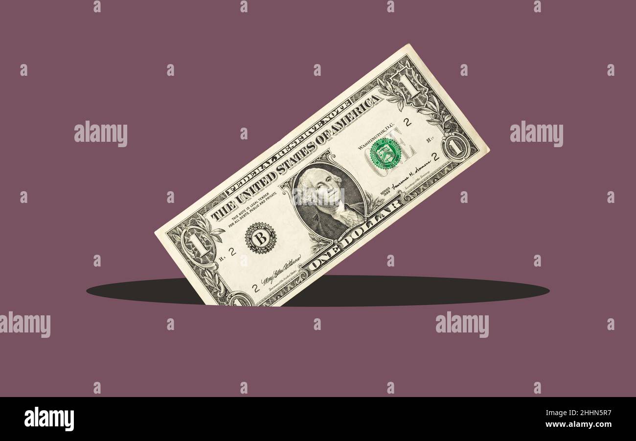 One US dollar bill falling down into a hole Stock Photo - Alamy