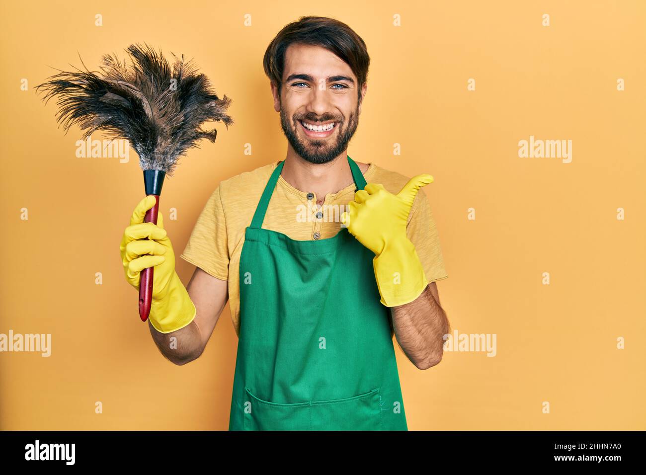 Man holding feather duster hi-res stock photography and images - Alamy