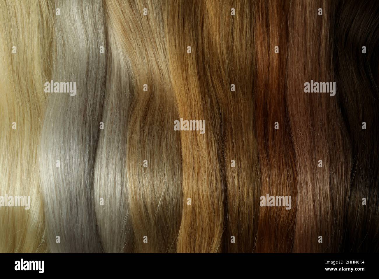 Different color female hair on whole background, close up Stock Photo ...