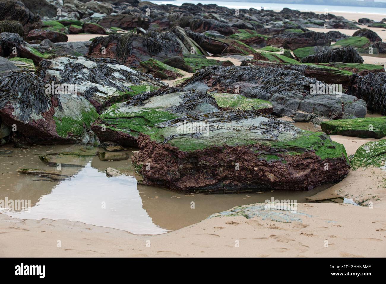Rocks and stones on the beach at Watergate Bay, Cornwall, England Stock ...