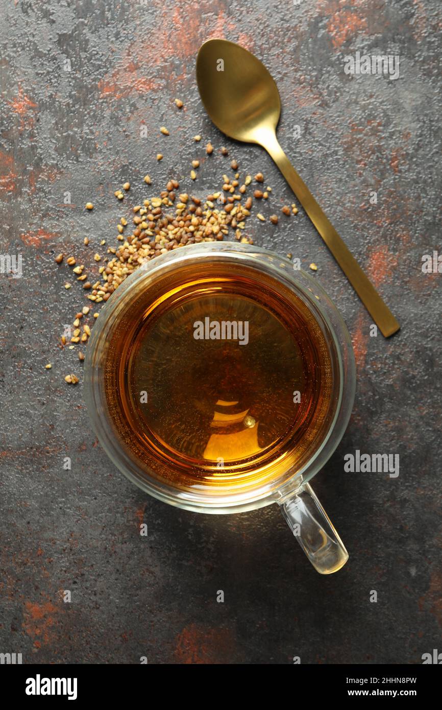 Concept of hot drink with buckwheat tea on dark textured background ...