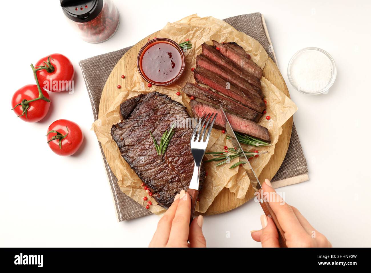 Concept of tasty eating with beef steaks on white background Stock ...