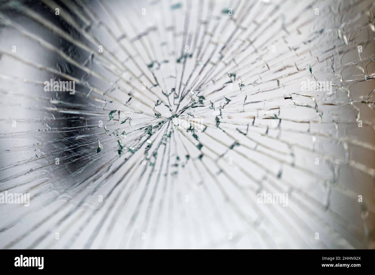Radial patterns in a shattered plate glass shop window Stock Photo - Alamy