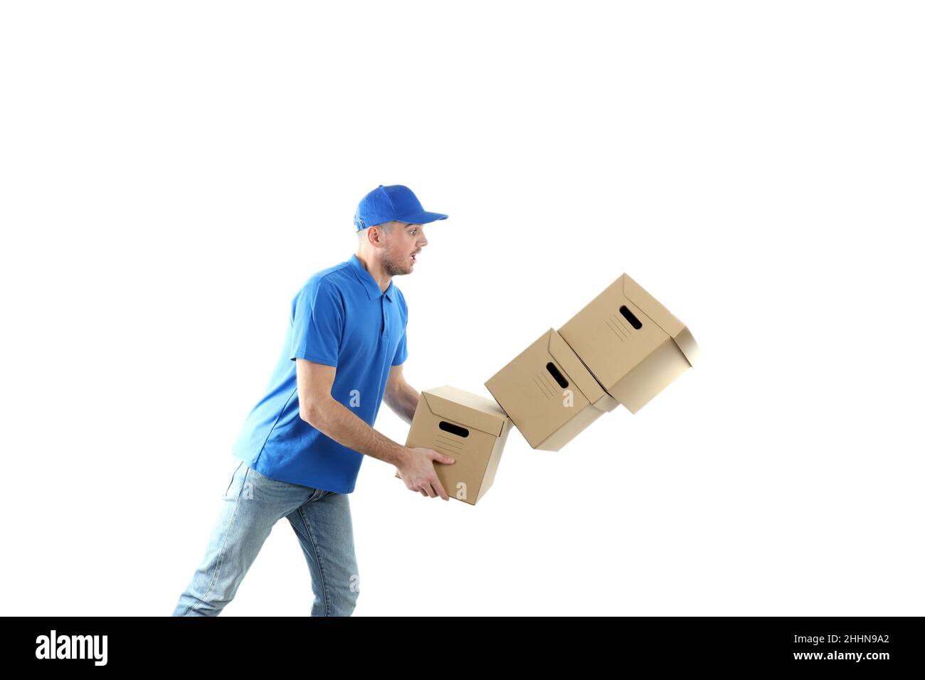 Delivery man with falling boxes, isolated on white background Stock ...