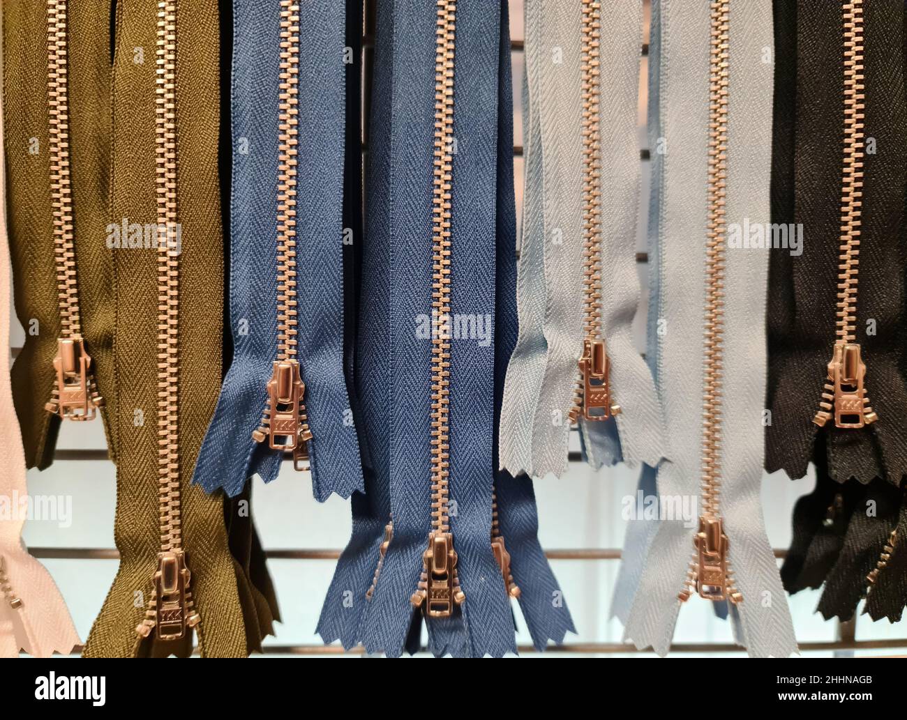 Many zips in different colours Stock Photo - Alamy