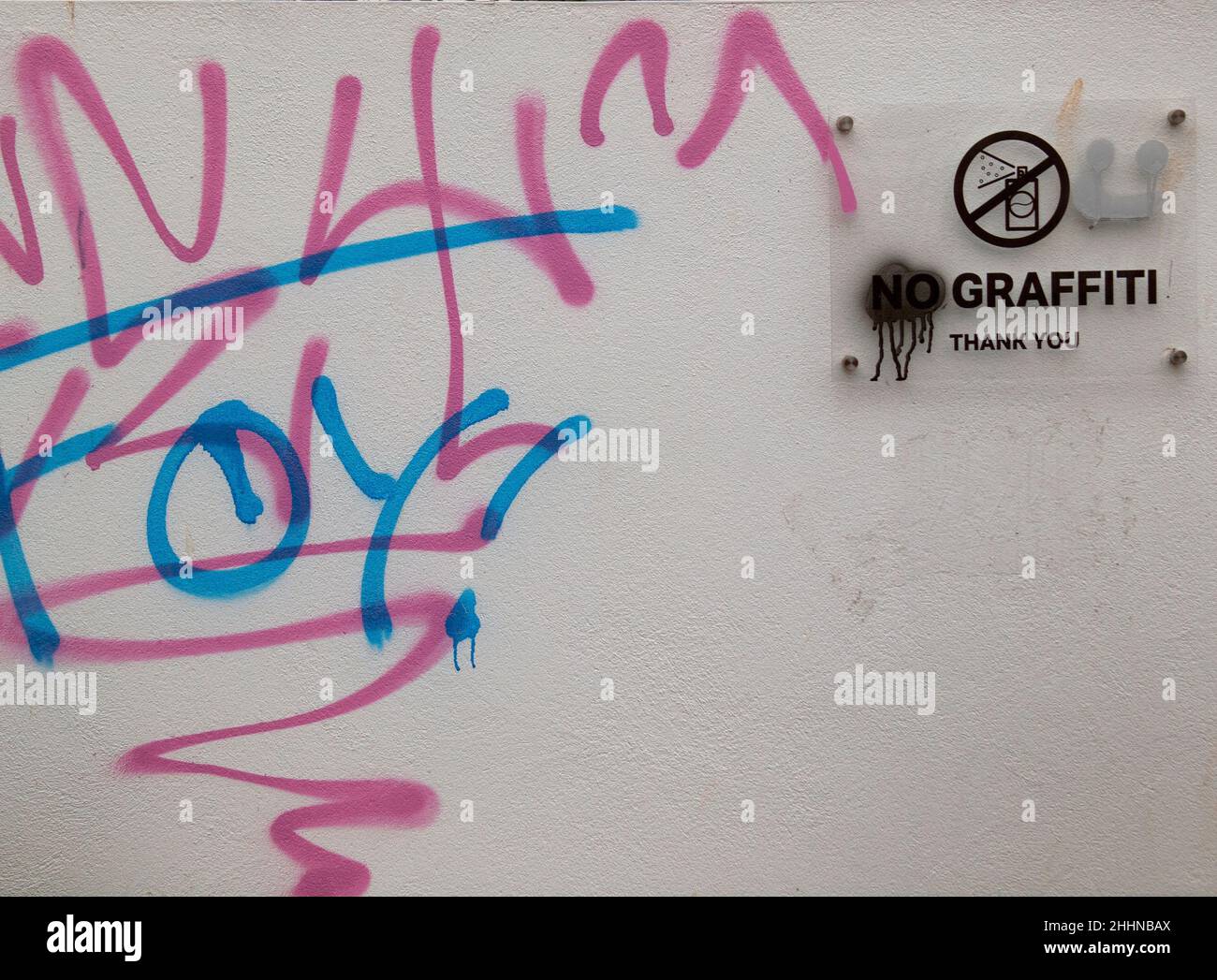 A white wall with tags in Brighton Stock Photo - Alamy