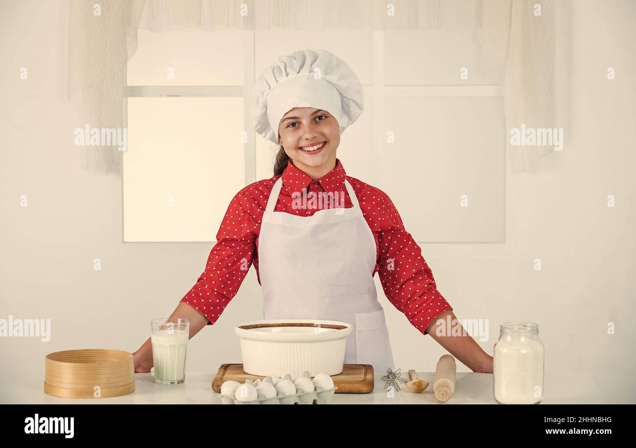 young baker girl in chef uniform, baking Stock Photo - Alamy