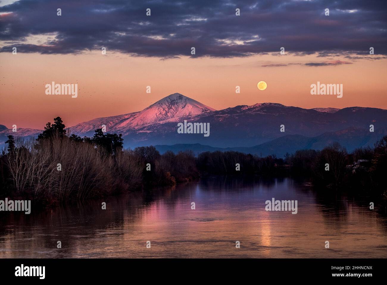 Landscape scenery of the moonrise (full moon) at sunset time and the ...
