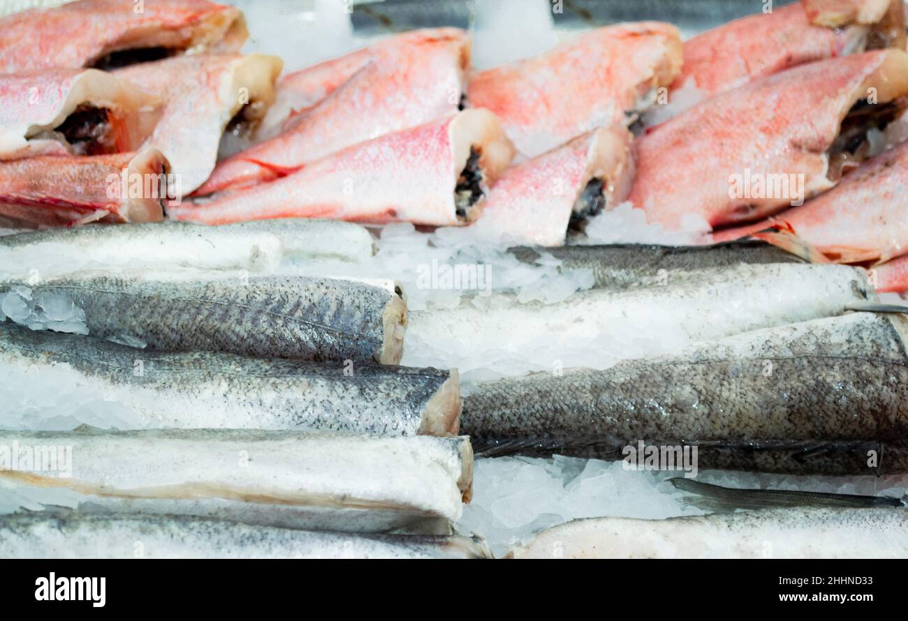 Chilled bass and cod carcasses on ice, sold at the fish market Stock ...
