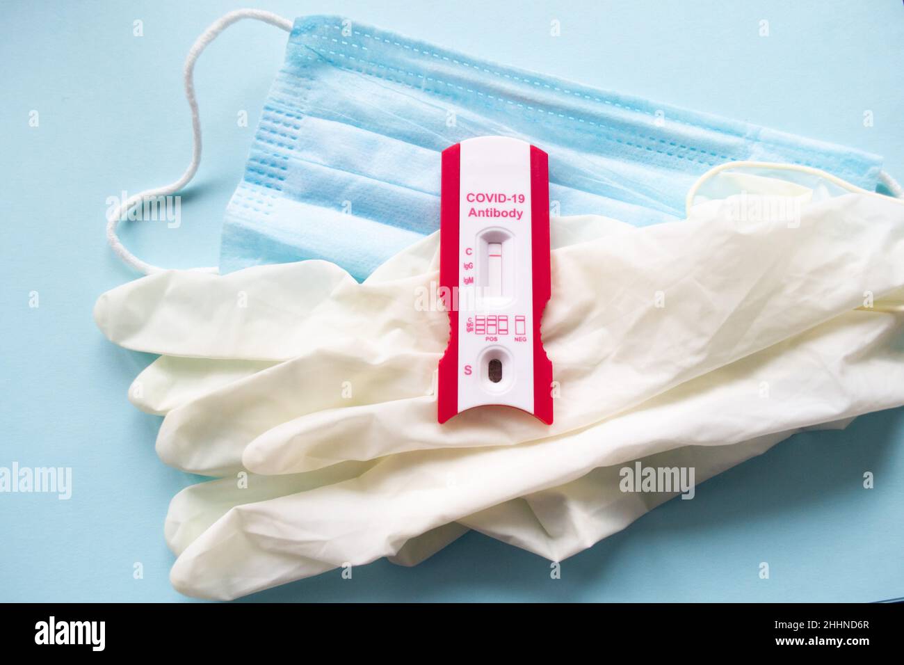 Negative test for Covid-19 with medical mask and gloves. Blue ...