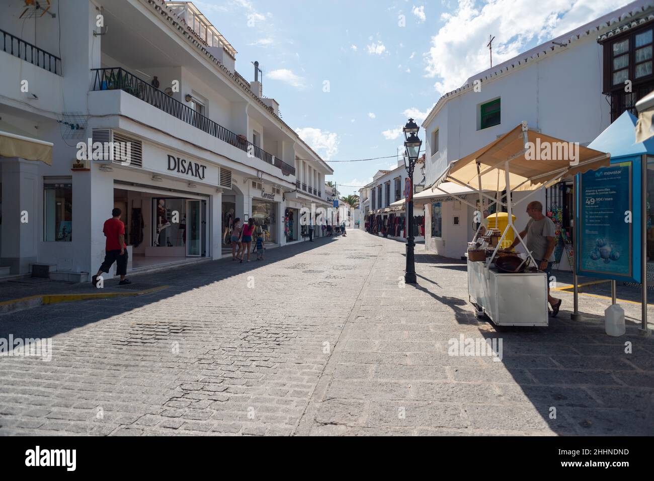Footpath amidst buildings in city Stock Photo - Alamy