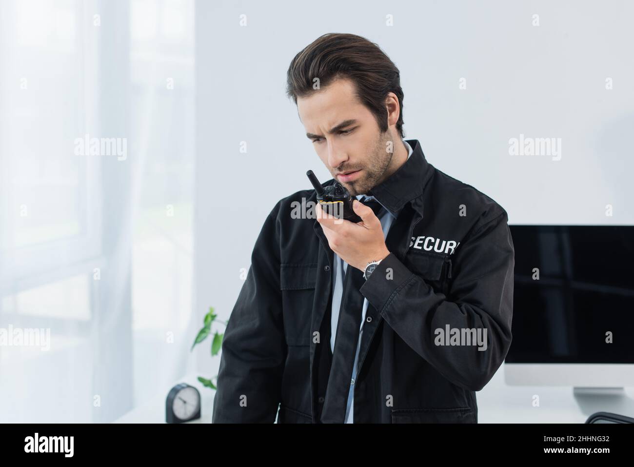 Black security guard radio set hi-res stock photography and images - Alamy