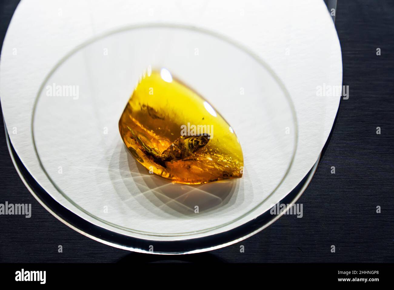 Natural amber on the table. Jewelry made of amber Stock Photo - Alamy