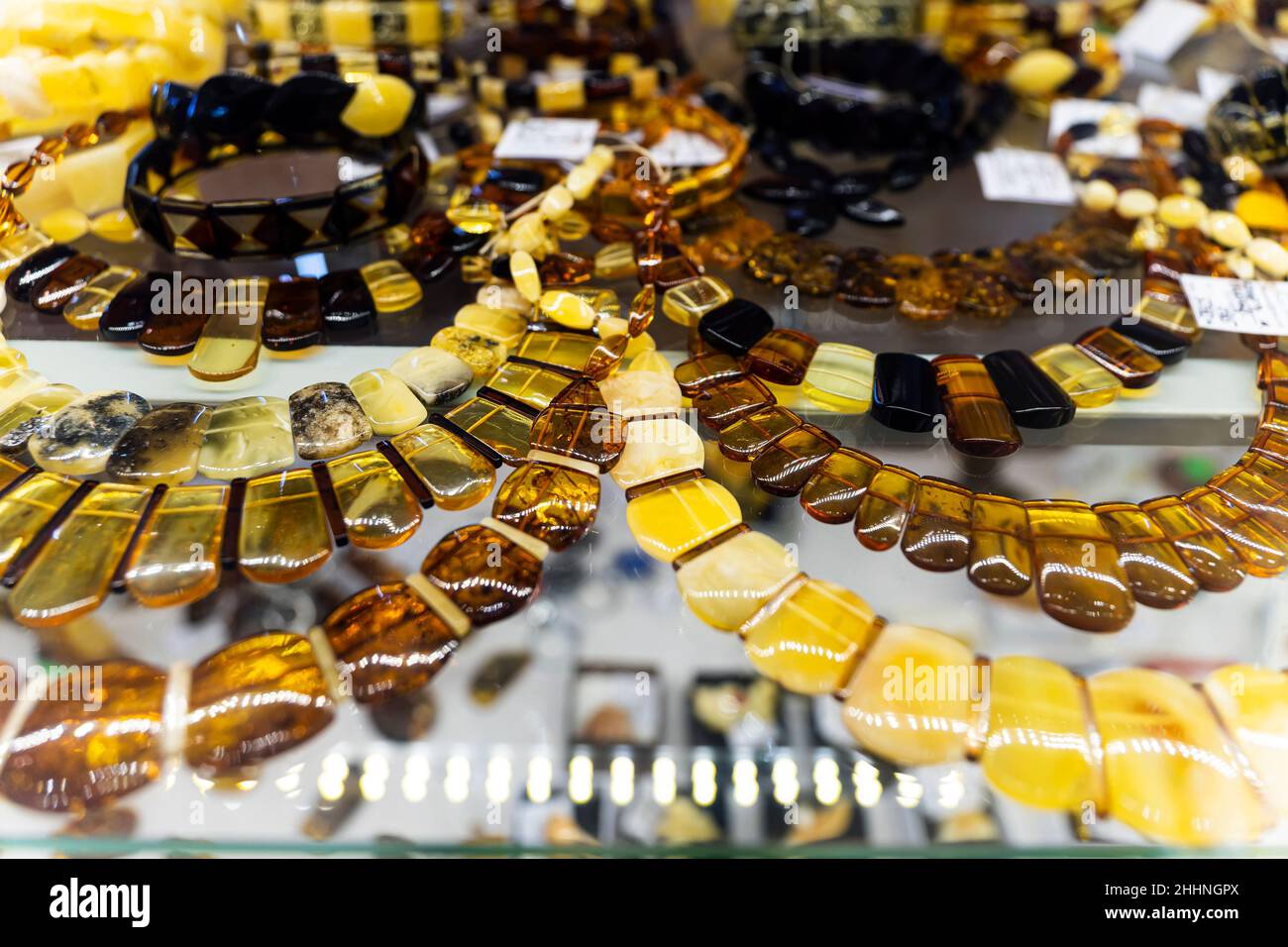 Natural amber on the table. Jewelry made of amber Stock Photo - Alamy