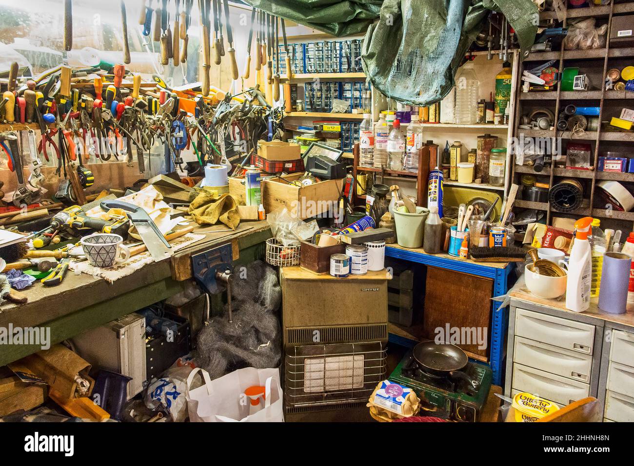 Messy section of market containg a vast selection of tools and ...