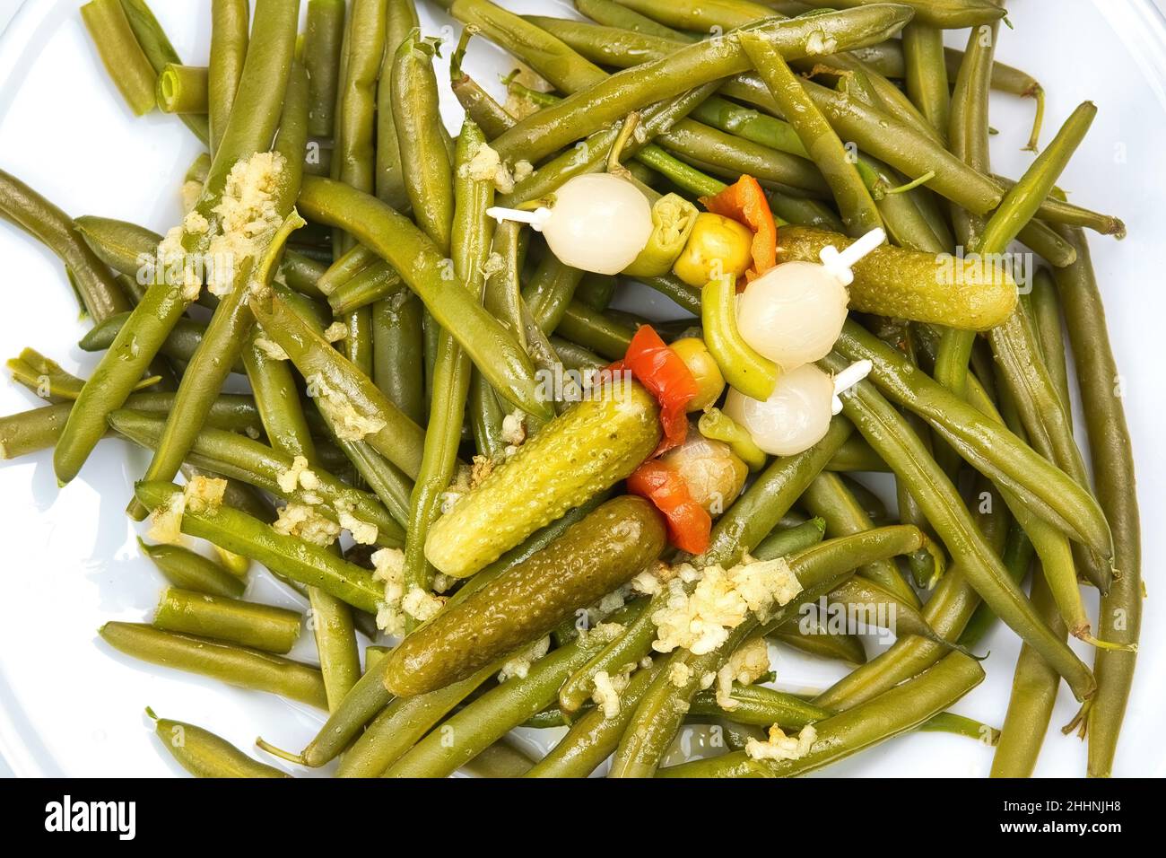 Cooked green beans vegetable garnished with pickles Stock Photo - Alamy