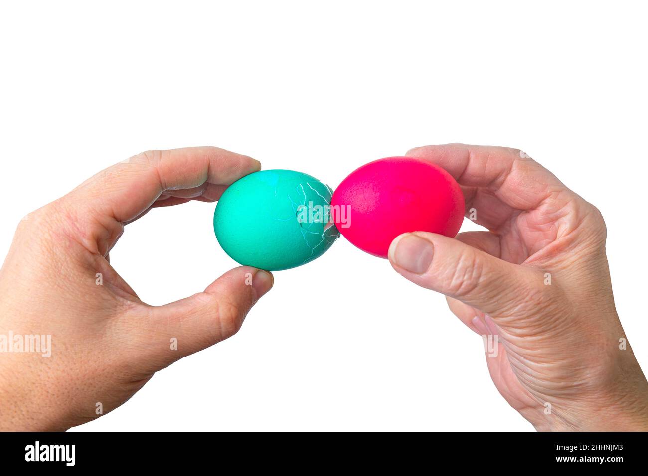 Easter tradition of cracking eggs, two hands hold eggs and try to break ...