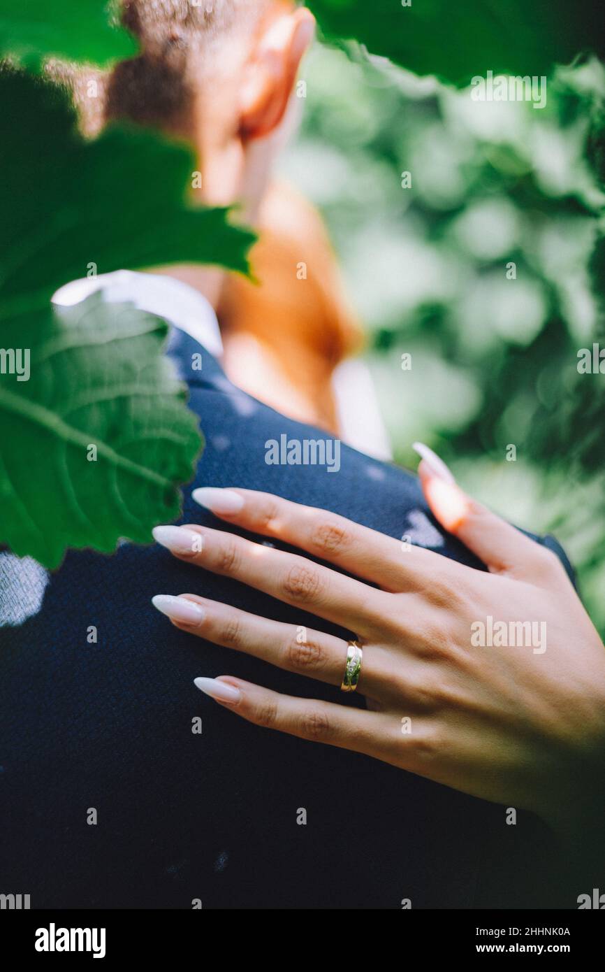 Bride and grooms hands with wedding rings Stock Photo - Alamy