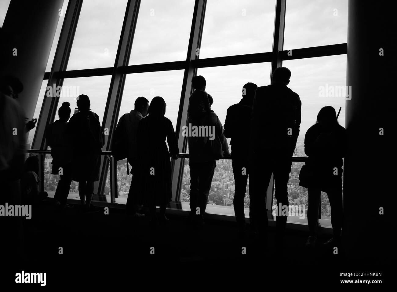 People looking through the window Stock Photo - Alamy