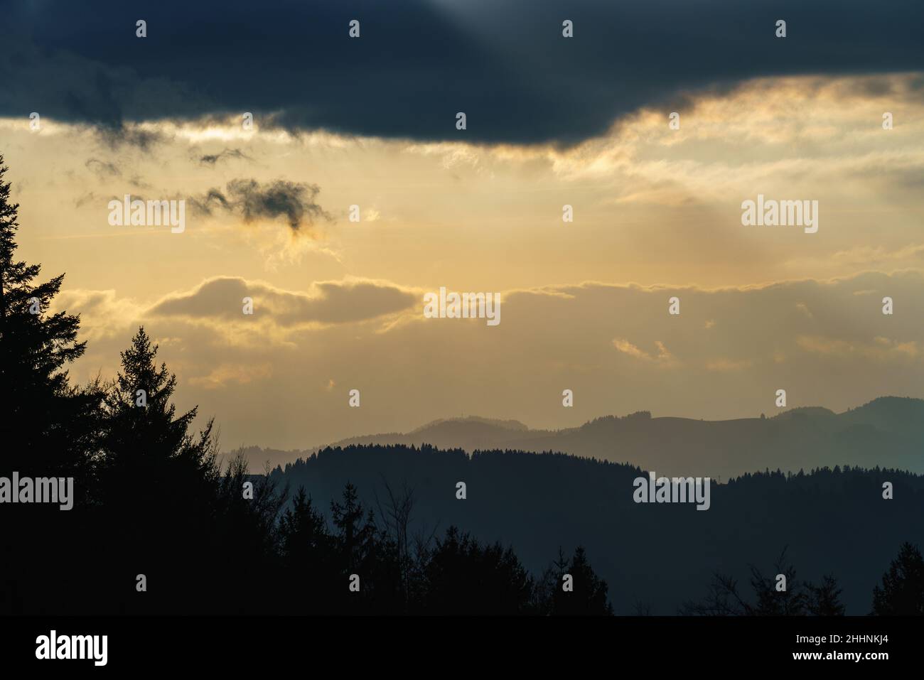 View of a mountain range in the Alps of Europe during sunset. Slopes in ...