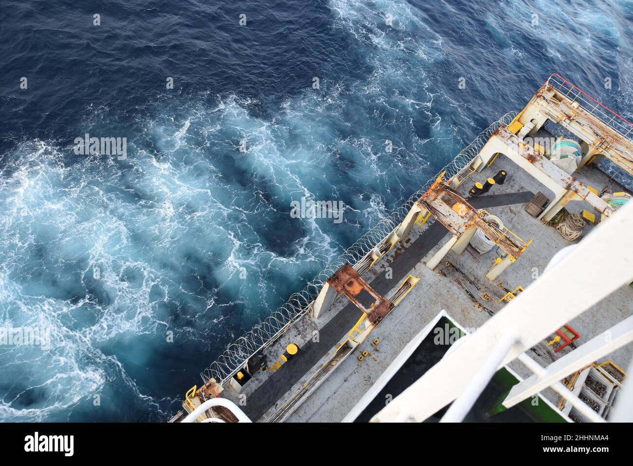 Sharp barbed wire or razor wire attached to the ship hull ...