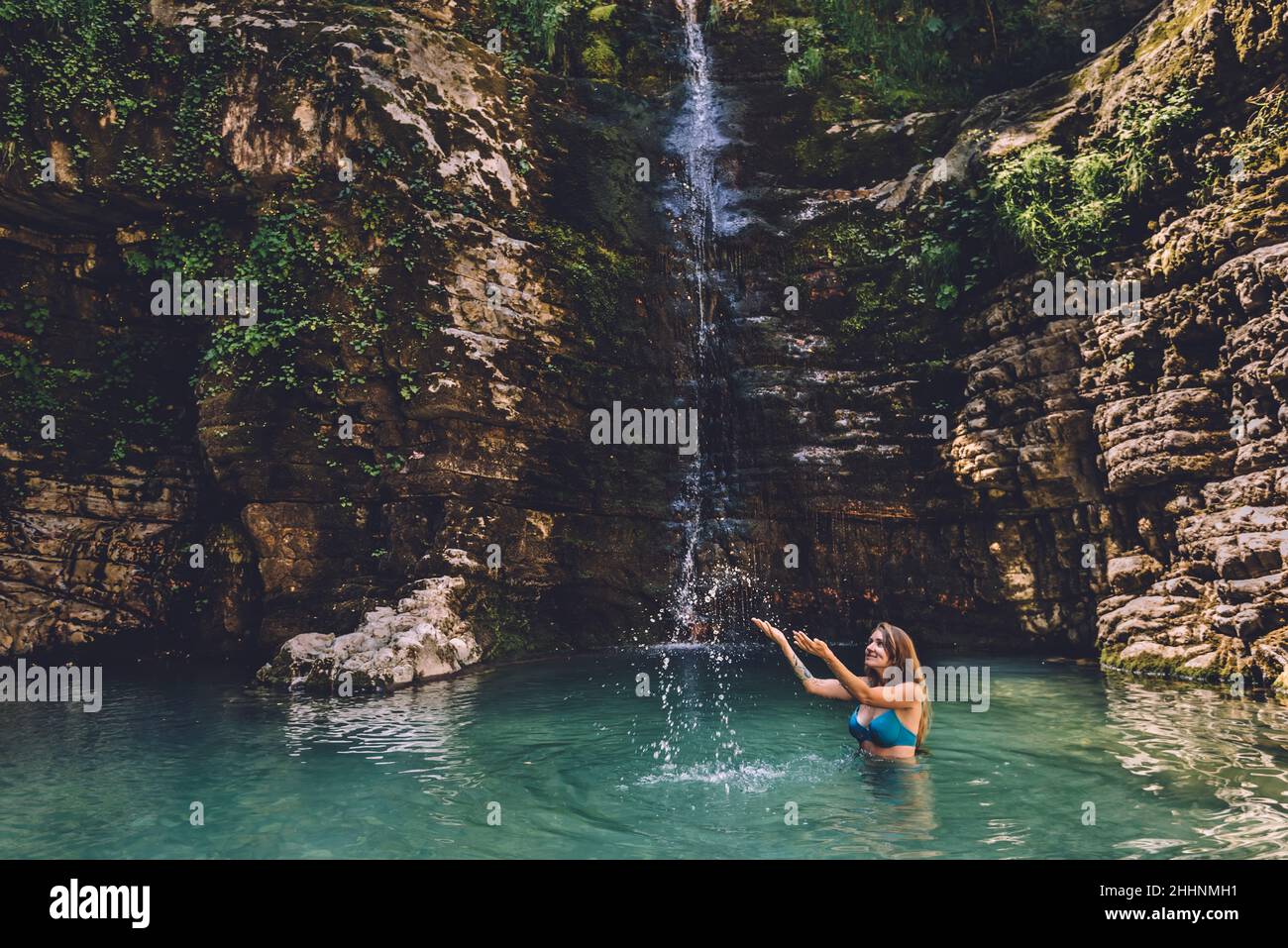 Woman waterfall bathing hi-res stock photography and images - Alamy