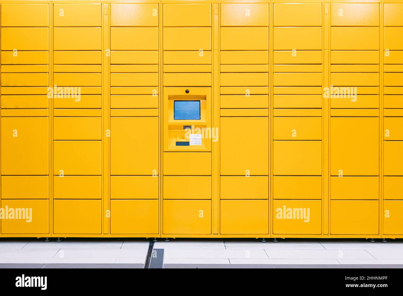 Yellow locker with screen and scanner for storage of packages purchased ...