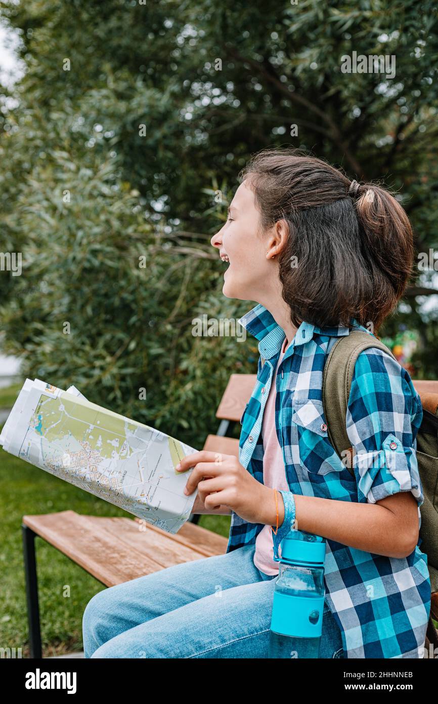 Emotional hipster young girl travels around the city. Cute brunette ...