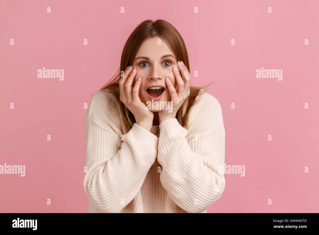 Portrait of positive blond woman looking nat camera with excitement ...