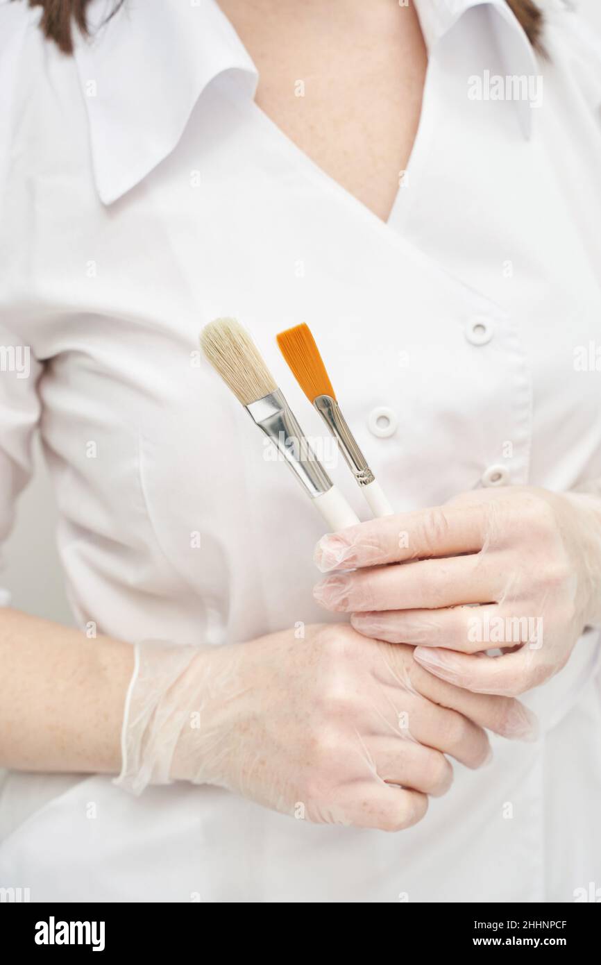 Doctor with cosmetology brushes. Hospital equipment. Online patient ...